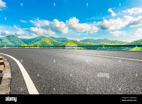 Asphalt Road And Green Mountain With Bamboo Forest Natural Landscape