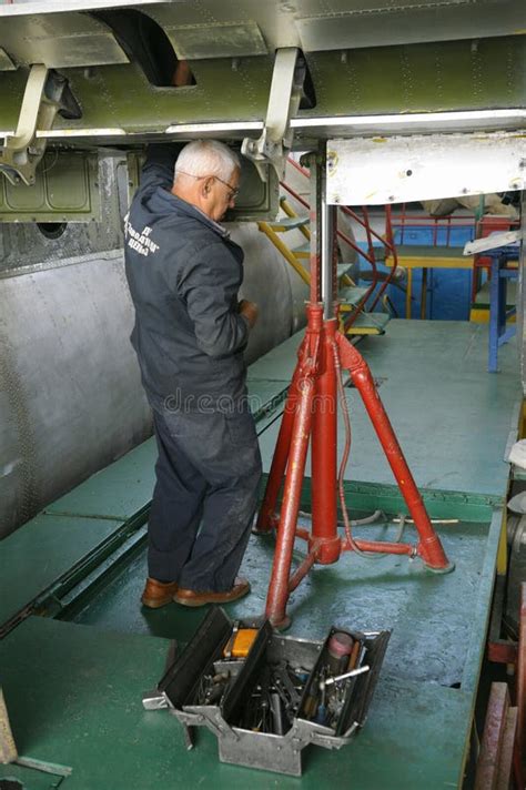 Plane Overhauling Electrician Installing New Electrical Wiring Inside
