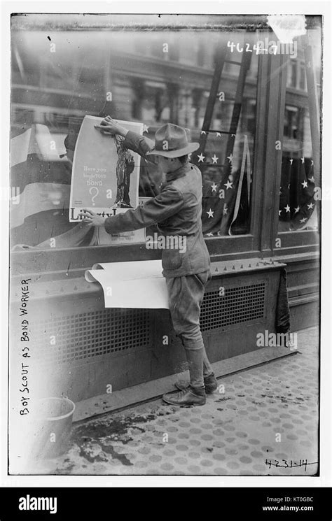 A Photograph Capturing A Boy Scout In A Work Setting Emphasizing The