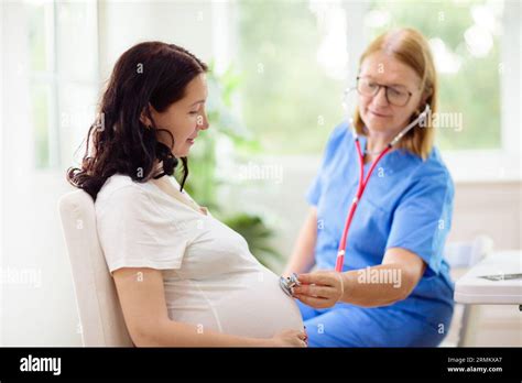 Doctor Examining Pregnant Woman Pregnancy Check Young Asian Female At
