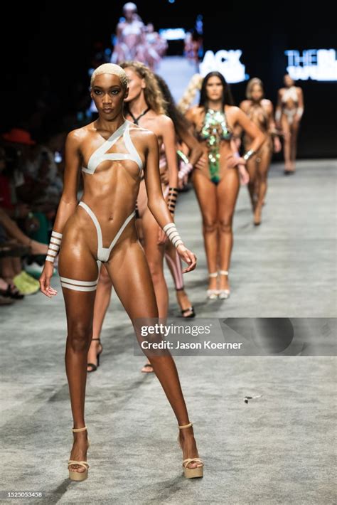 A Model Walks The Runway Wearing Black Tape Project During Miami Swim