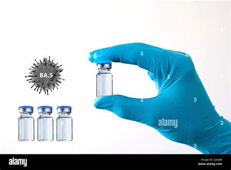 Hand In Gloves Holding A Glass With Vaccine Against Corona Variant Ba