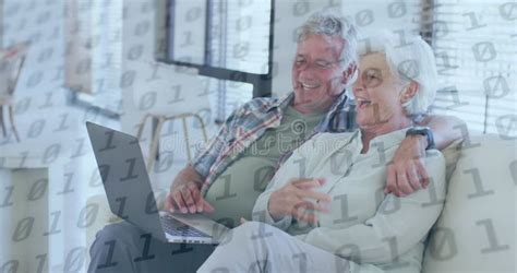 Image Of Binary Coding Over Senior Caucasian Couple Using Laptop Stock