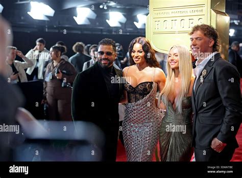 From L R Russel Wilson Ciara Marissa Ayers And Jaxson Dart Pose