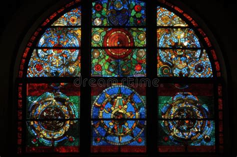 Stained Glass Window With Mosaic Of Intricate Patterns And Shapes Stock