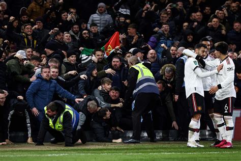 Moment Advertising Hoarding Collapses During Man Utd Fans Wild Celebrations Against Nottingham