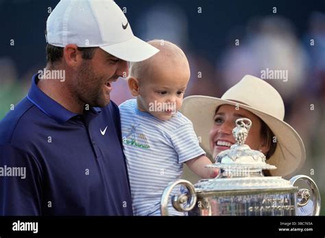 Scottie Scheffler His Wife Meredith Pose With Their Son Bennett After Winning The Pga