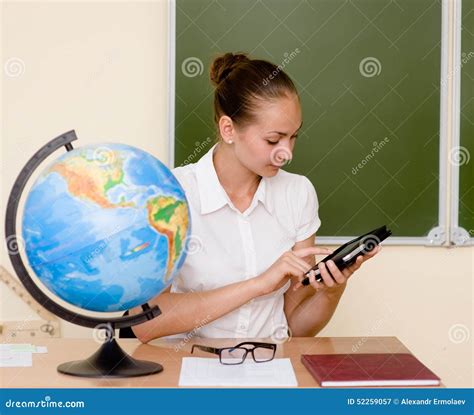 teacher using a tablet computer at classroom stock image image of