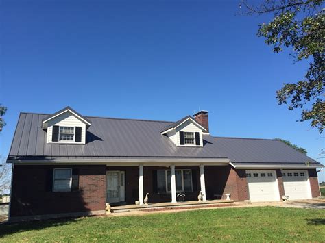 Grey Brick House With Metal Roof At Owen Griver Blog