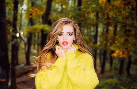 Beautiful Autumn Woman With Autumn Leaves On Fall Nature Background