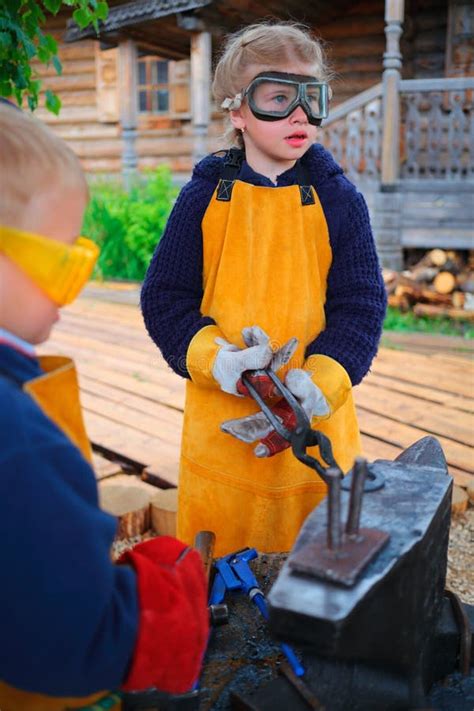 Brother And Sister Stand Near Anvil Tongs Sister Stock Image Image