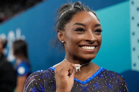 Why Was Simone Biles Wearing A Goat Necklace And What Does Goat Even Mean