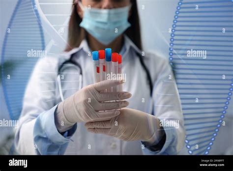 Genetic Testing Laboratory Worker With Test Tubes And Illustration Of Dna Structure Double