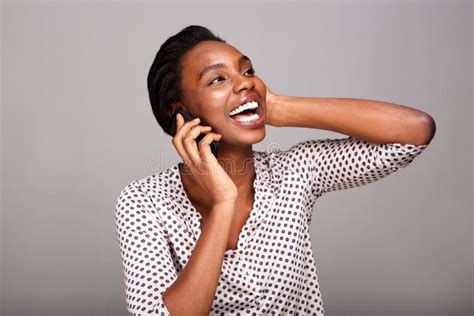Beautiful Woman Talking On Mobile Phone And Laughing Stock Image