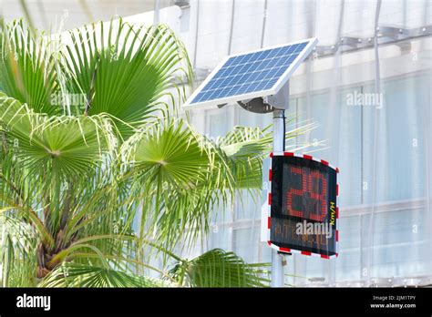 Informative Digital Speed Sign With Solar Panel On The Street Of A