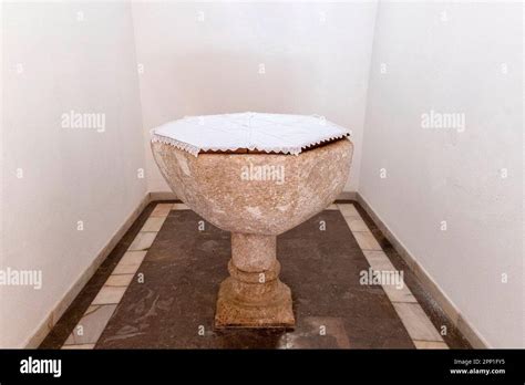 Unique Stone Baptism Sink Inside A Christian Church In Portugal Stock