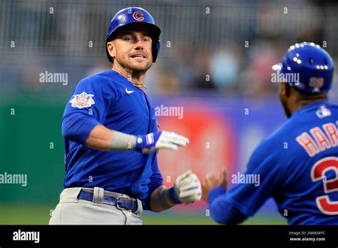 Chicago Cubs Patrick Wisdom Left Celebrates With Third Base Coach