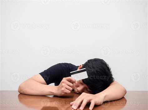Man Tried From Working Laying Head Down Hold Credit Card Strain With