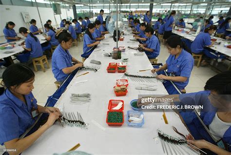 Workers Assemble Goods At A Hong Kong China Joint Venture Factory
