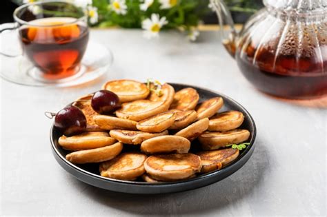 Premium Photo Homemade Sweet Mini Pancakes With Cherry Jam And