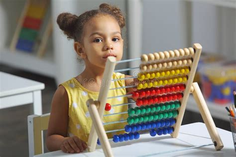 A Black African American Girl Is Ready For A Math And Arithmetic Lesson