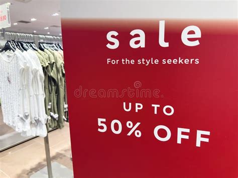 Sale On Clothing Items Up To 50 Percent Off For Style Seekers Displayed In A Retail Store