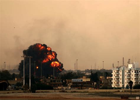 Crisis In Libya Us Bombs Qaddafis Airfields Cbs News