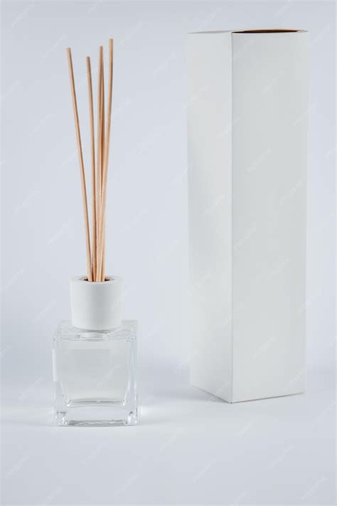 Premium Photo Aroma Diffuser With Bamboo Sticks And White Box On White Background