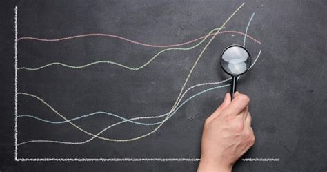 Premium Photo A Womans Hand Points To A Graph With Growing Indicators Drawn