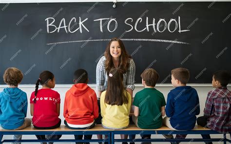 Happy Elementary School Teacher Giving Highfive To Her Student During
