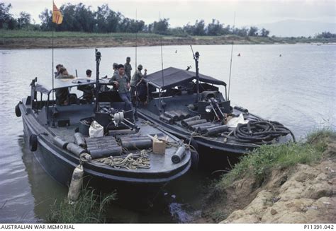 Two Patrol Boat River Pbr Tied Up At The River Bank At Hoi An On The