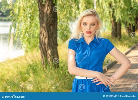 Portrait Of A Beautiful Blonde Girl Outdoors In Summer Stock Image