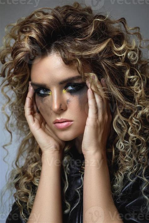 Sexy Woman With A Stylish Afro Hairstyle And Smeared Make Up Wearing