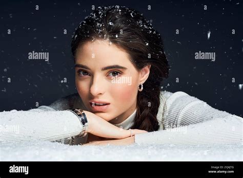 A Lovely Woman Enjoys The Beauty Of Winter While Embracing Delicate