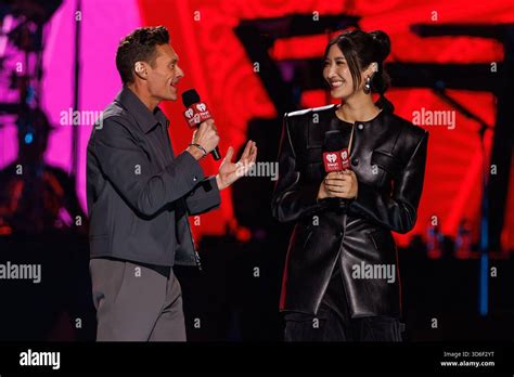 Host Ryan Seacrest And Ejae Speak On Stage During The Iheartradio Music Festival At T Mobile