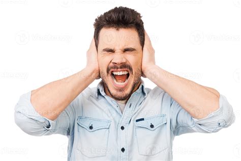 Emotional Stress Frustrated Young Man Holding Hands On Ears And Keeping Eyes Closed While