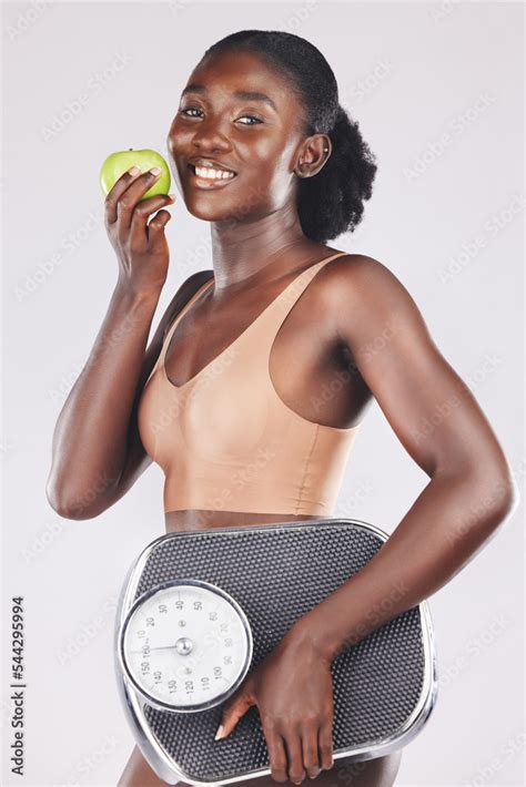 Apple Scale And Weightloss With A Black Woman In Studio On A Gray