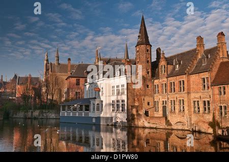 Belgium Bruges Canal Waterfront And Historic Buildings At Night Stock