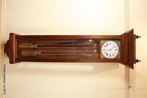 A French Comtoise Clock With A White Enamel Dial With Roman… Fine