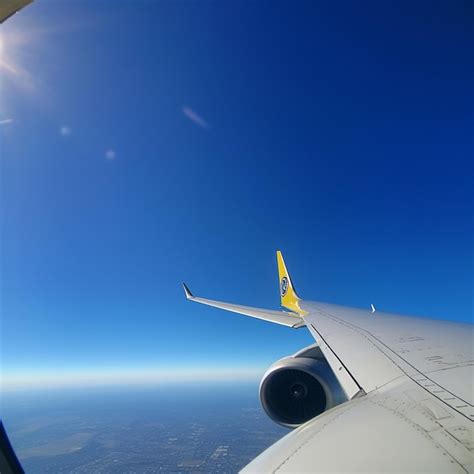 Premium Ai Image A Plane Wing With The Sun Shining On It