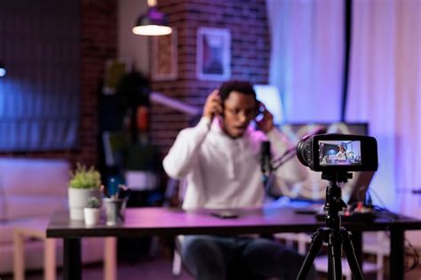 Premium Photo Focus Shot On Modern Camera Recording Vlogger In Blurry