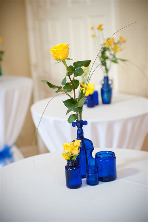 Blue Bottles Yellow Flowers Centerpieces Wedding Yellow Flower