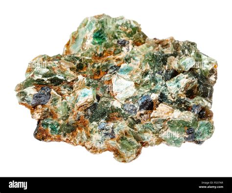 Macro Shooting Of Natural Mineral Green Beryl And Emerald Crystals In Raw Rock Isolated On
