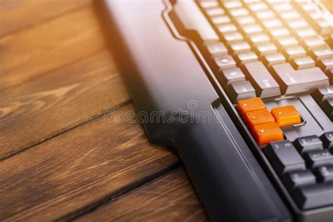 Orange Arrow Keys On A Black Keyboard Up Down Left Right Buttons On A Gaming Computer