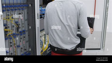 Technician Performing Maintenance Tasks In A Server Room Rack Stock Photo Alamy