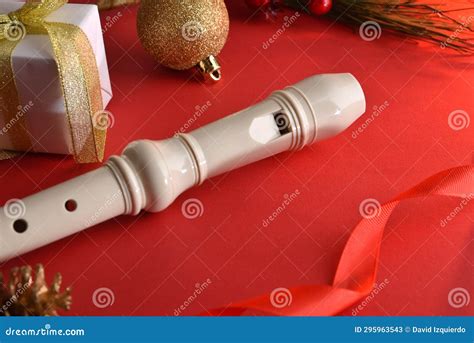 Traditional Plastic Flutes On Red Table With Christmas Decoration Stock