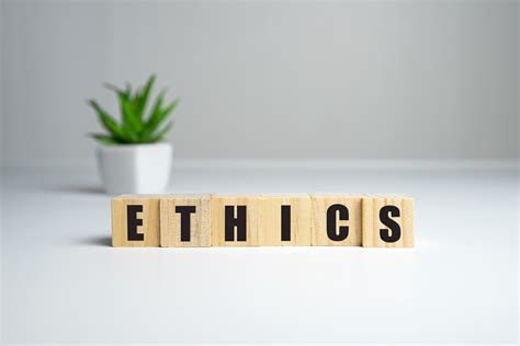 Premium Photo Wooden Blocks With The Word Ethic Defending