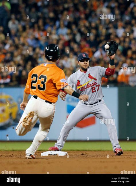 San Francisco Giants left fielder Nori Aoki (23) out at second by St. Louis Cardinals shortstop ...