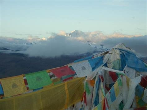John And Martymt Everest And Prayer Flags