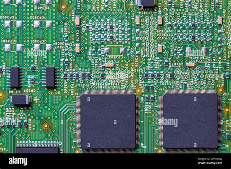 Closeup Of Micro Processor Chip On Motherboard In Computer Green